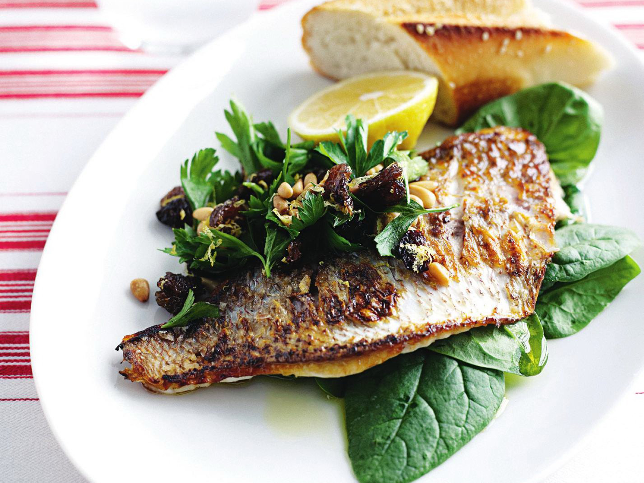 Pan-fried fish with spinach and lemon raisin salad | Women's Weekly Food