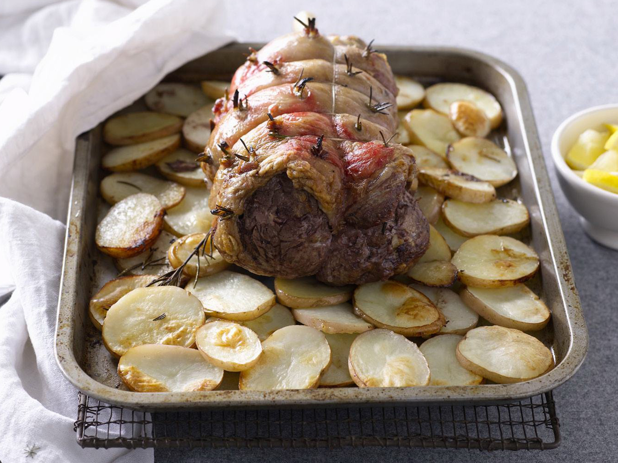 Leg of lamb on lemon scented potatoes | Women's Weekly Food
